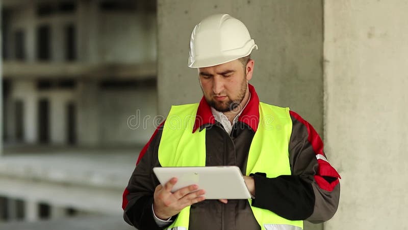 Builder with Tablet Computer on Construction Site Stock Video - Video ...
