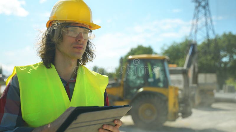 Builder with tablet pc stock photo. Image of yellow - 222761702