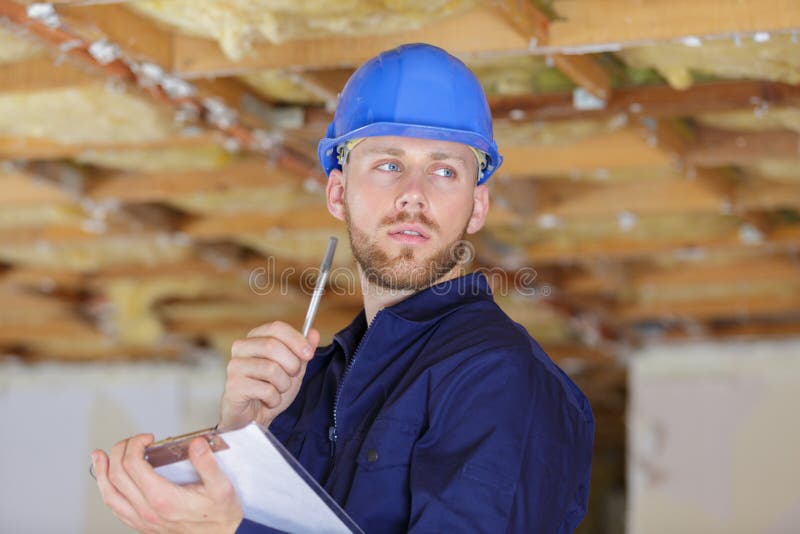 Builder Thinking and Holding Clipboard Stock Image - Image of holding ...