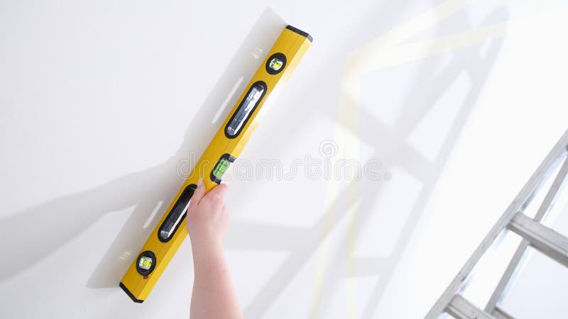 Builder Uses Building Level To Check Verticality of Wall Stock Photo ...