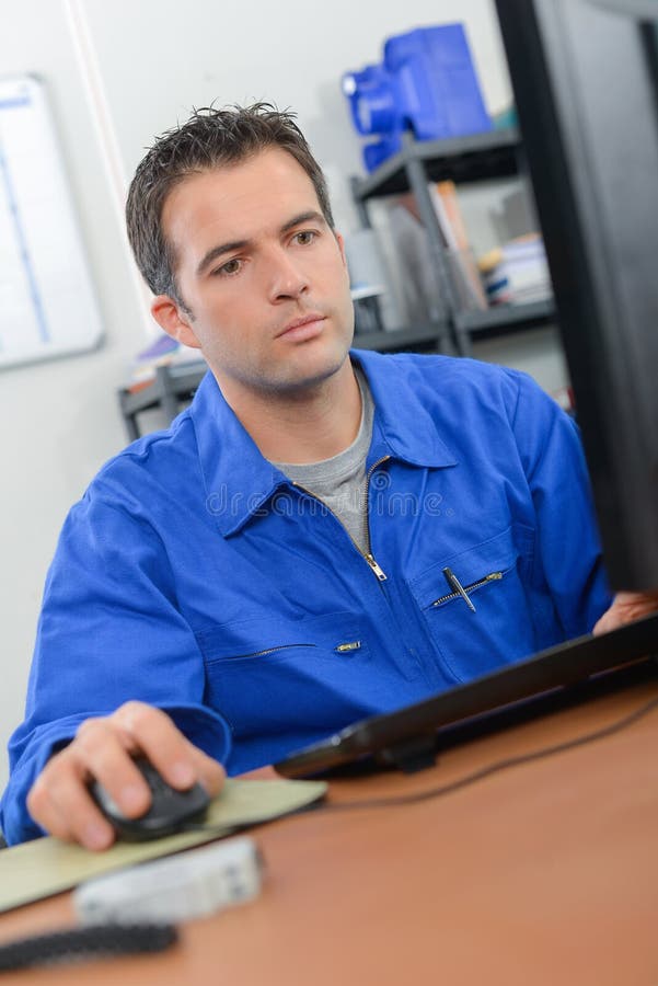 Builder using computer stock photo. Image of profession - 188227216