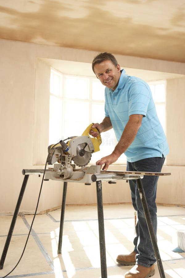 Builder Using Electric Saw stock photo. Image of contractor - 12407762