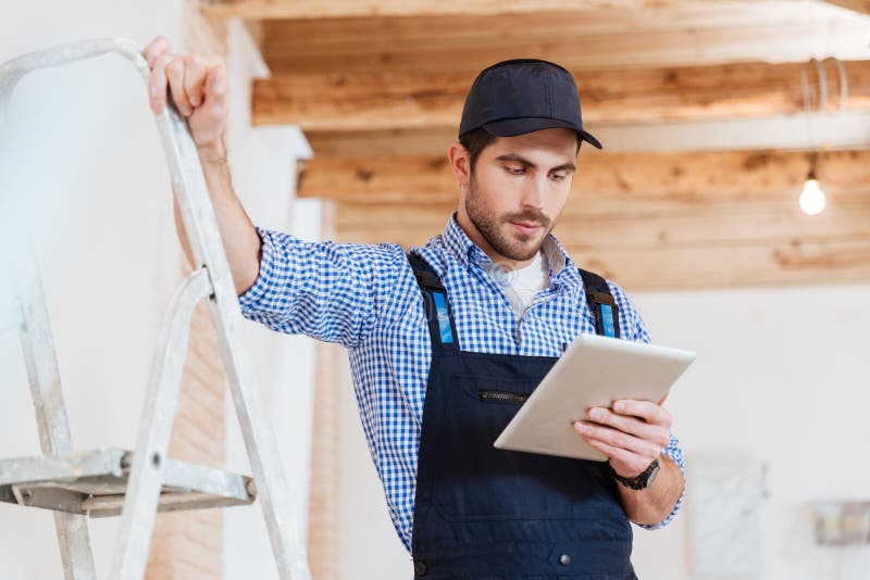 Builder Using Pc Tablet Computer in His Work Stock Image - Image of ...