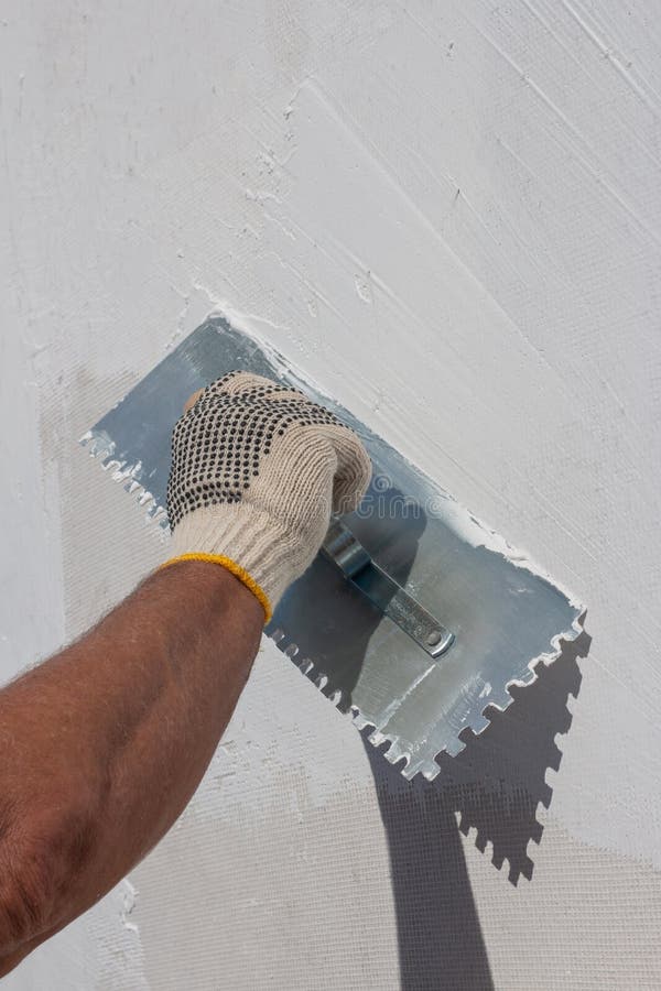 Builder Using Plastering Tool for Finishing Wall Stock Photo - Image of ...
