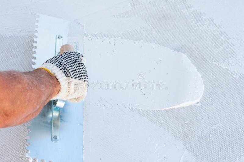 Builder Using Plastering Tool for Finishing Wall and Floor Stock Photo ...