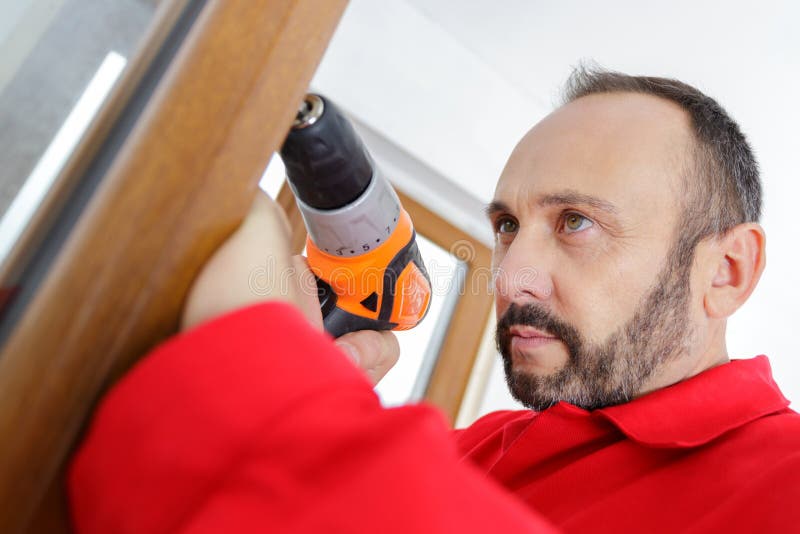 Builder using power tool stock photo. Image of hold - 264987426