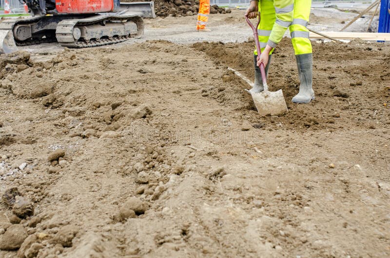 Builder Using Shovel To Clean Kerbs and Footpath Acidentaly Covered by ...