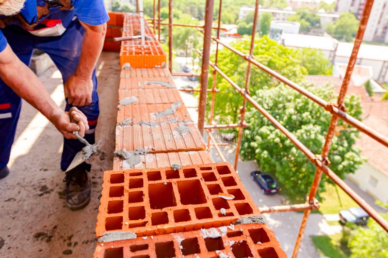 Builder Using Spatula To Remove Surplus Mortar Stock Photo - Image of ...