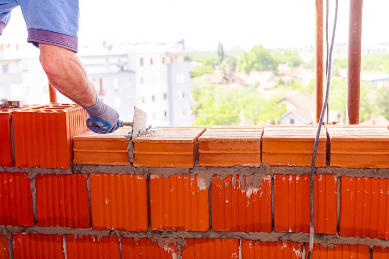 Builder Using Spatula To Remove Surplus Mortar Stock Photo - Image of ...