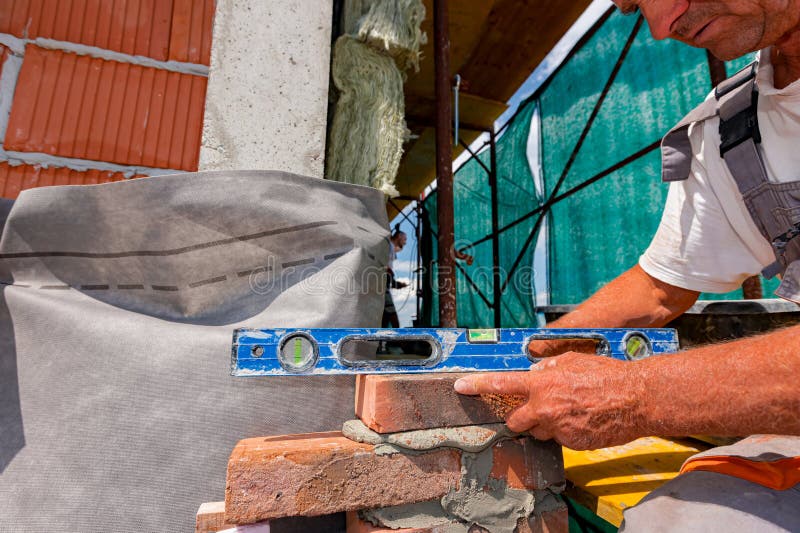 Worker is Using a Spirit Level To Control Brick Wall Editorial Stock ...