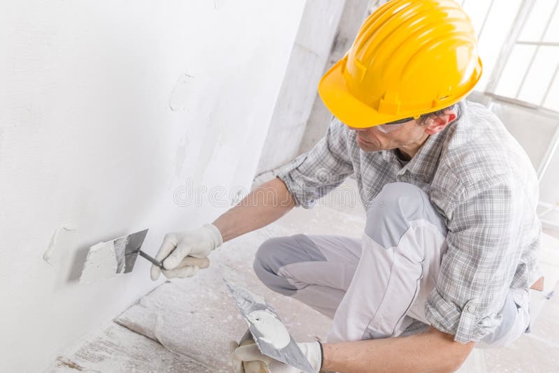 Builder Using a Trowel To Add Plaster To a Wall Stock Photo - Image of ...