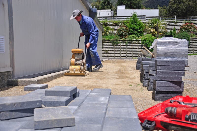 Setting out the pavers stock image. Image of brick, colleagues - 29861675
