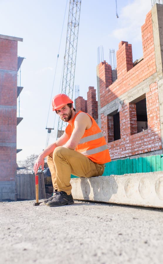 Builder Vest and Helmet Construction Site Sit Relaxing. Guy Protective ...