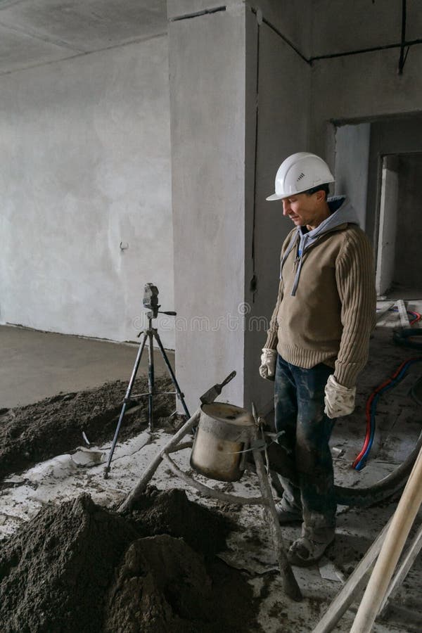 A Builder in Work Clothes is Doing His Job Stock Image - Image of ...