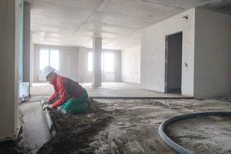 A Builder in Work Clothes is Doing His Job Stock Photo - Image of ...
