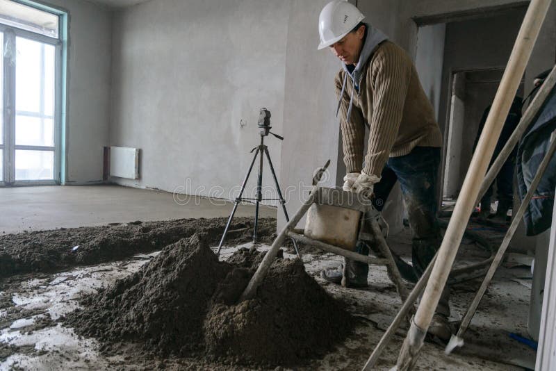 A Builder in Work Clothes is Doing His Job Stock Photo - Image of frame ...