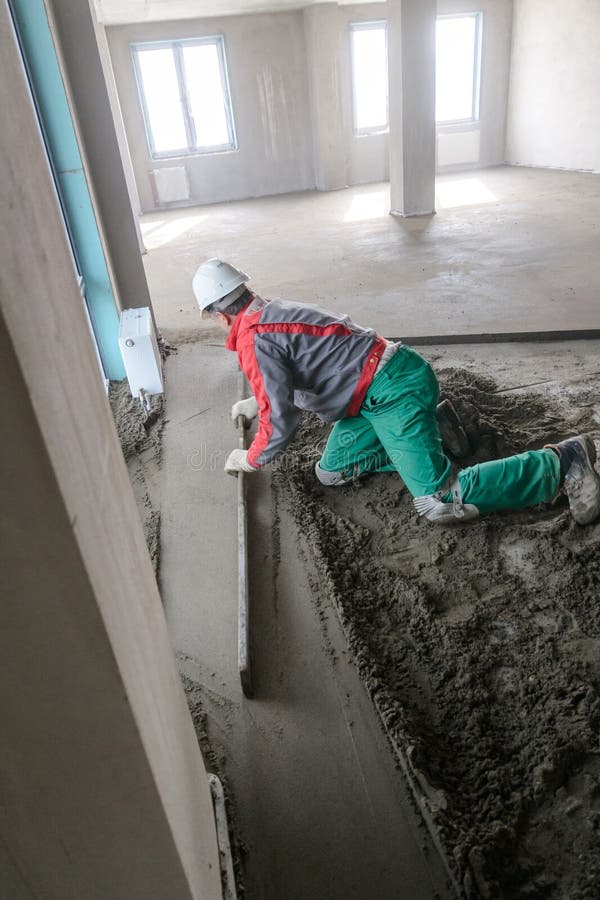 A Builder in Work Clothes is Doing His Job Stock Photo - Image of build ...