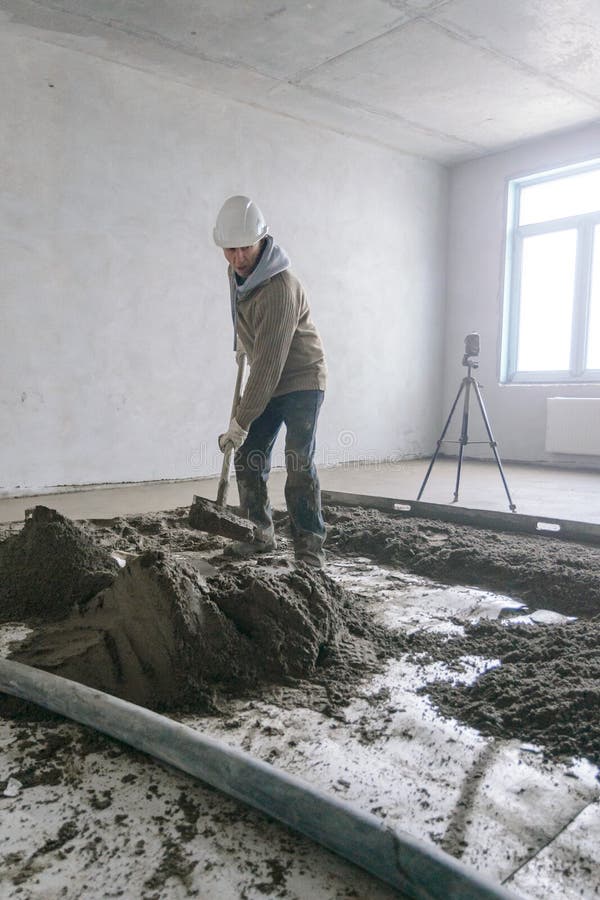 A Builder in Work Clothes is Doing His Job Stock Image - Image of ...