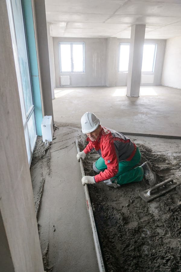 A Builder in Work Clothes is Doing His Job Stock Image - Image of ...