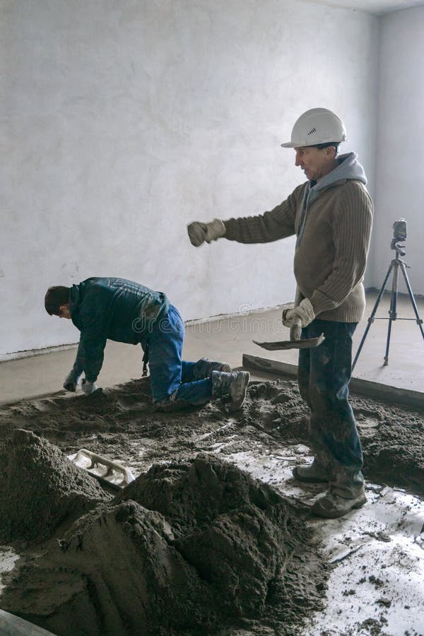 A Builder in Work Clothes is Doing His Job Stock Image - Image of ...