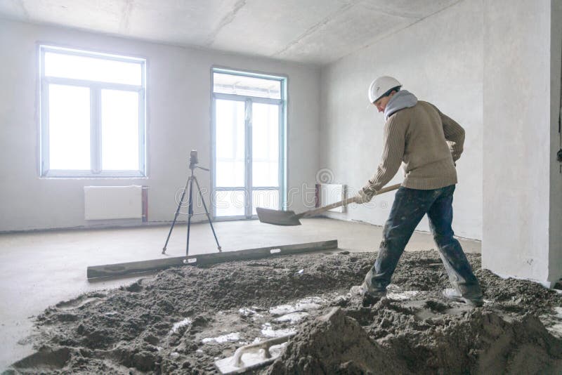 A Builder in Work Clothes is Doing His Job Stock Photo - Image of ...