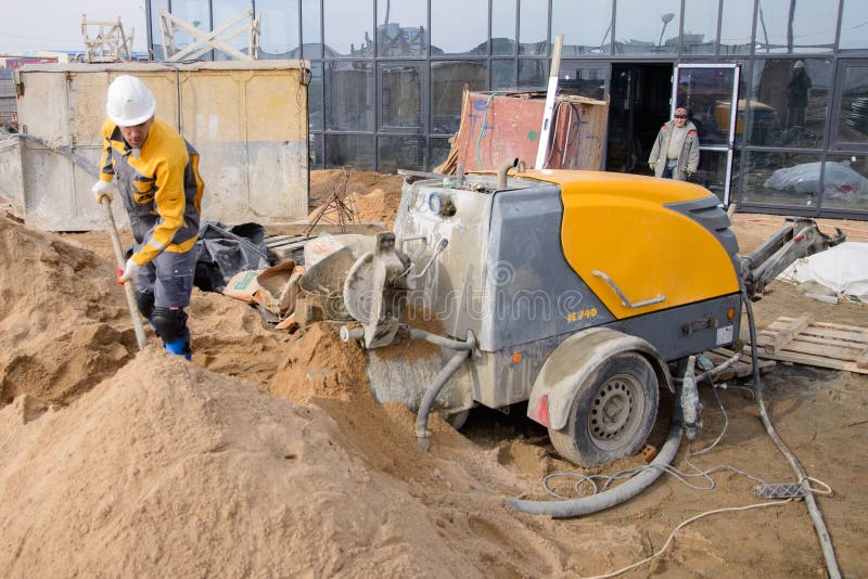 A Builder in Work Clothes is Doing His Job Stock Image - Image of ...