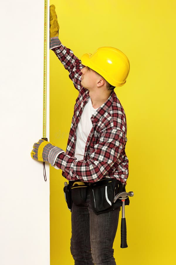 Builder in Work Clothes, Helmet Taking Measurements of Wall Stock Photo ...