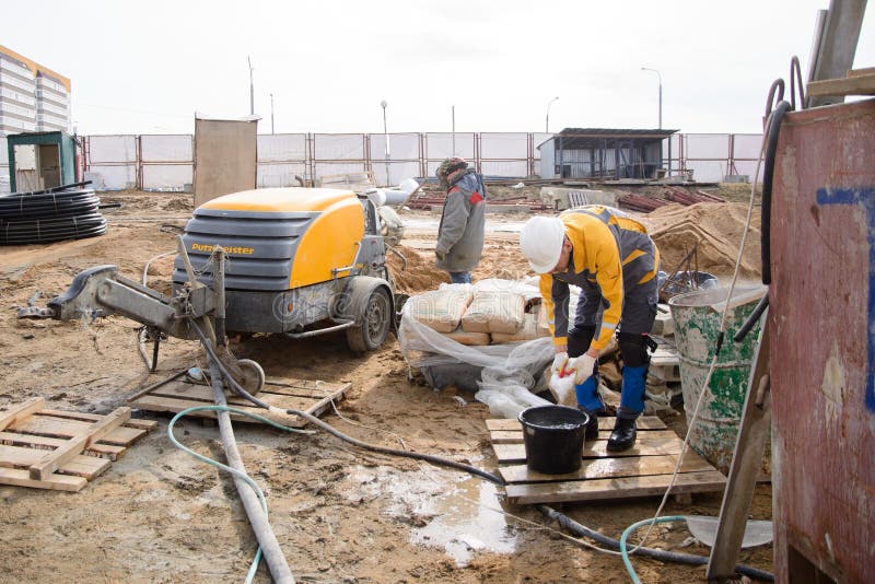 Builder in Work Clothes Prepares Tools and Materials Stock Image ...
