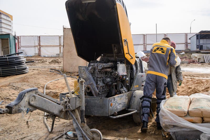 Builder in Work Clothes Prepares Tools and Materials Stock Photo ...