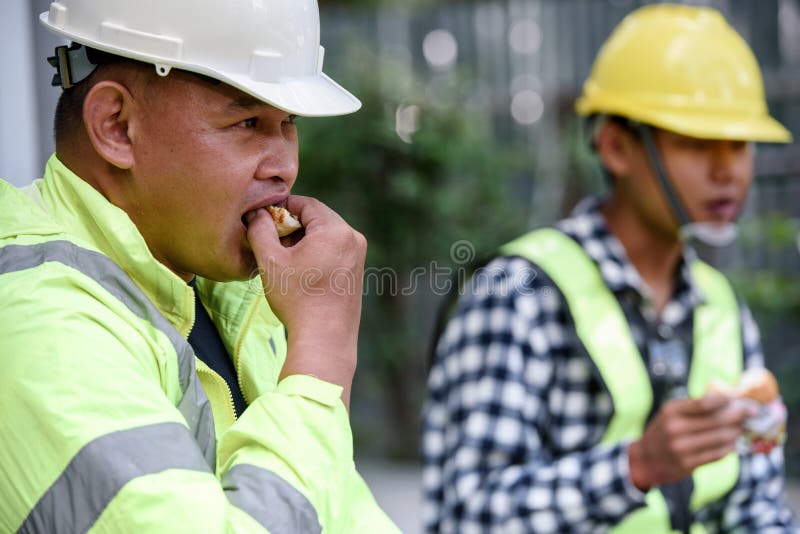 Builder Worker Eats at Construction Site Stock Photo - Image of ...