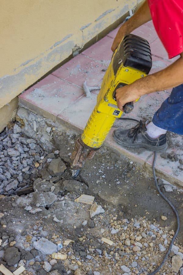 Sidewalk crack repairing stock image. Image of builder - 35000333