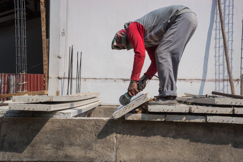 Builder Worker with Grinder Machine Cutting Concreate Floor Stock Photo ...