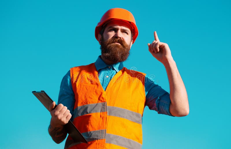 Builder Worker in Helmet Posing on Construction Site. Building and ...