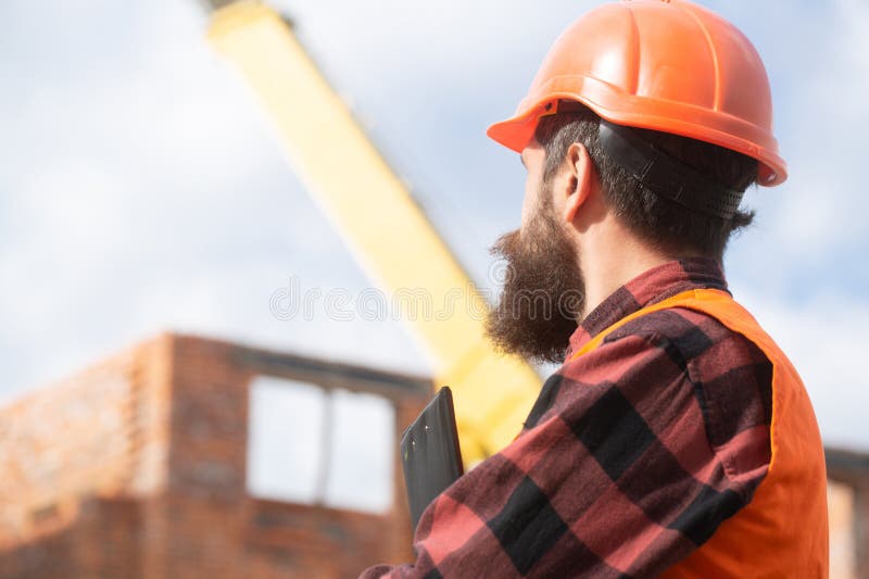 Builder Worker in Helmet Posing on Construction Site. Portrait of ...
