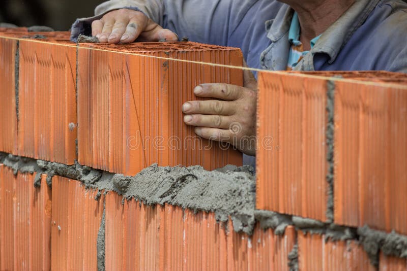 Builder Worker Installing Clay Block Wall, Lay Clay Block Stock Photo ...