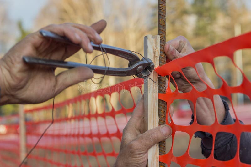 Builder Worker Installing Construction Safety Fence 3 Stock Photo ...