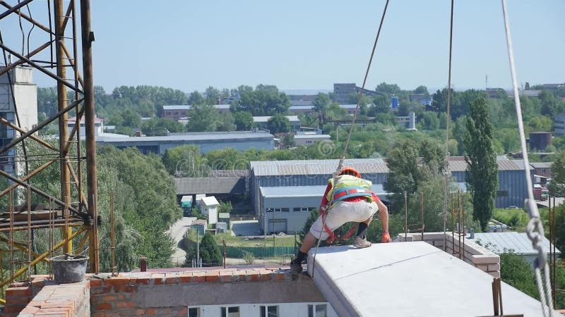 Builder Worker in Safety Protective Equipment Installing Concrete Floor ...