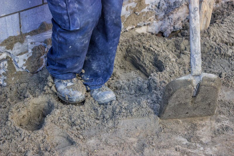 Builder Worker Tamping Sand Bedding with a Feet Stock Photo - Image of ...