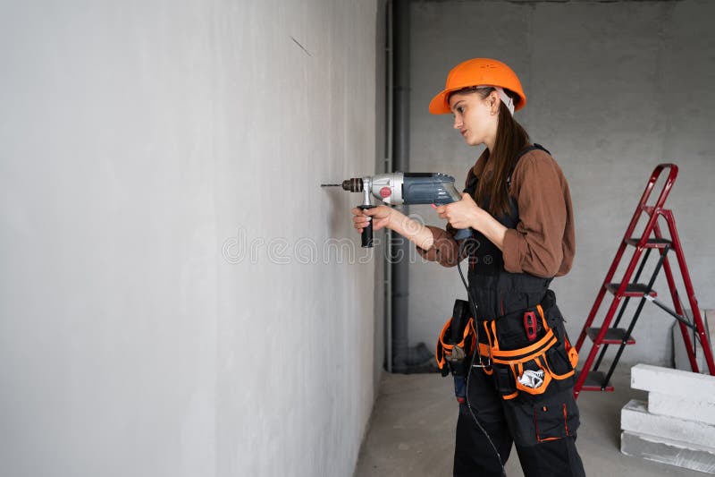 Builder Worker Using Drill Perforator Making Hole in Wall at ...