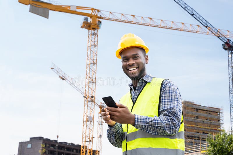 Builder Worker Using Phone stock image. Image of construction - 253053519