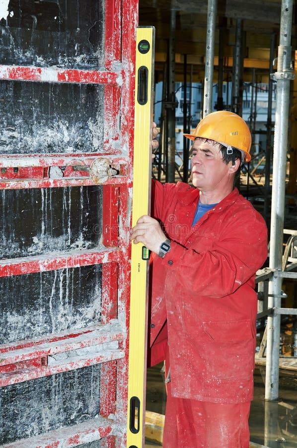 Builder working with level stock image. Image of build - 14471957