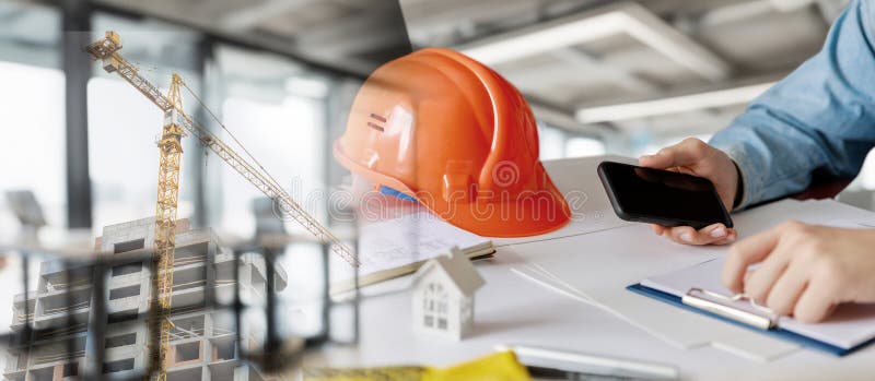 A Builder is Working in an Office on a House Project Stock Photo ...