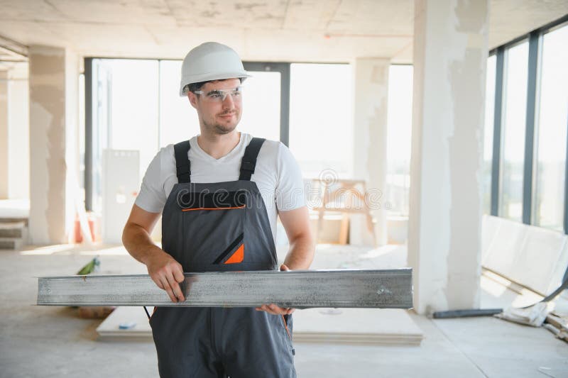 Builder in Working Uniform Cutting Metal Profile with Cutting Machine ...