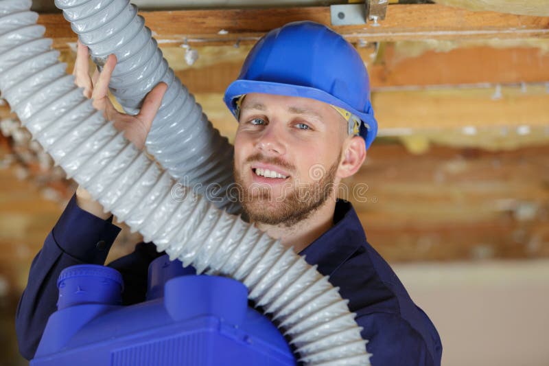 Builder Working on Ventilation Pipes Stock Image - Image of alone ...