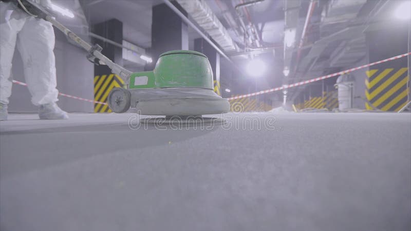 Builder Works Concrete Floor with Special Equipment. Concrete Floor ...