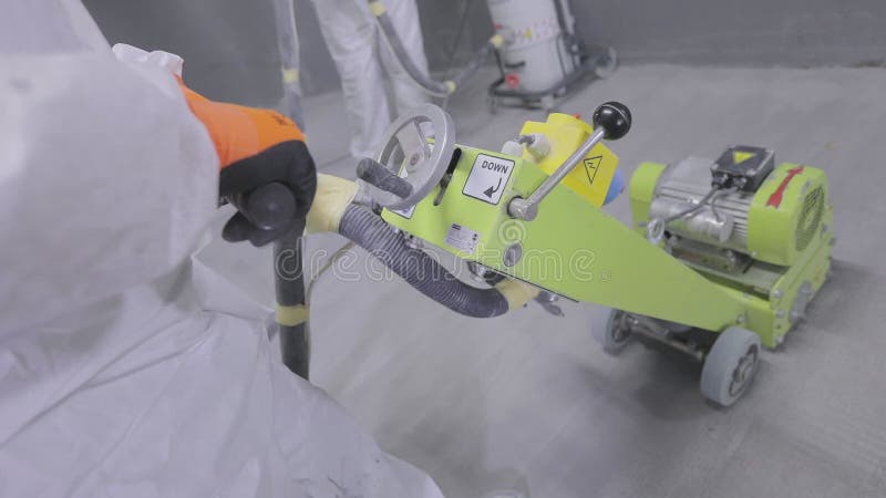 Builder Works Concrete Floor with Special Equipment. Concrete Floor ...