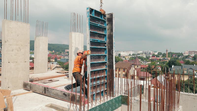 The Builder Works on the Construction Site. Installation of Metal ...