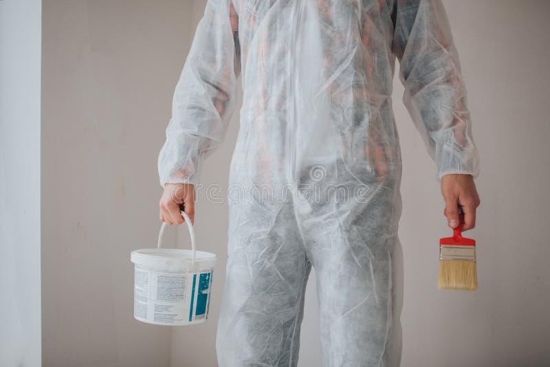 The Builder Works at the Construction Site and Measures the Ceiling ...