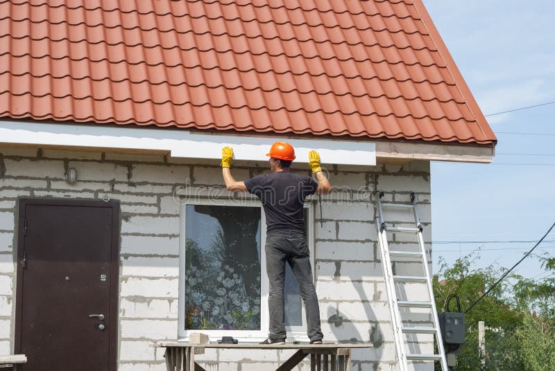 Builder works on the roof stock photo. Image of construction - 96841768