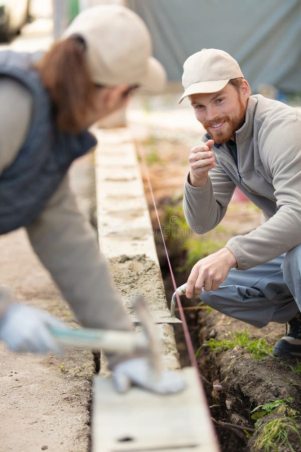 Builders Building Cement Wall Stock Image - Image of slab, hammer ...